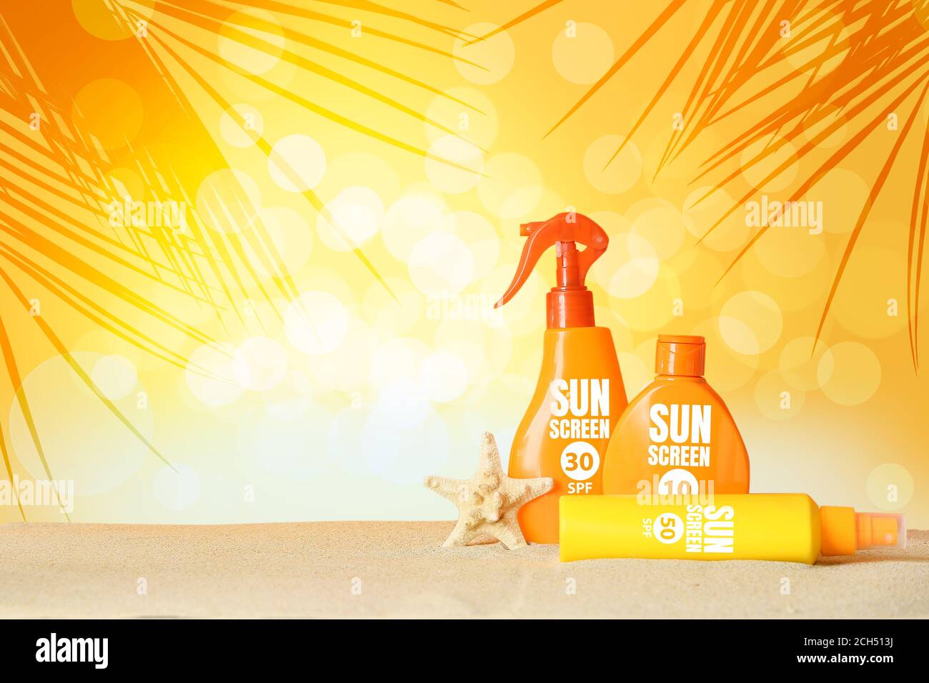 Bottles of sunscreen cream on beach sand at resort Stock Photo - Alamy