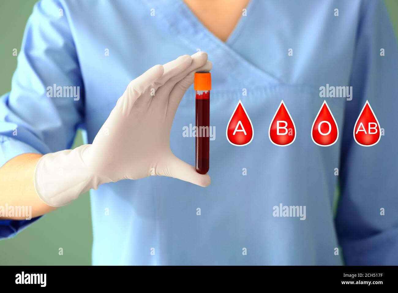Test tube in doctor's hand. Determining of blood types Stock Photo - Alamy