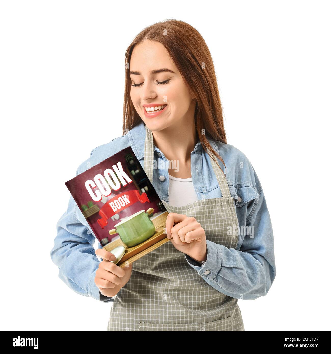 Young woman with cook book on white background Stock Photo - Alamy