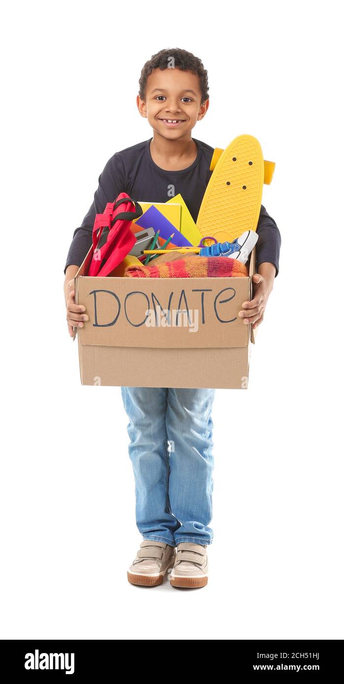 Little African-American boy with donations on white background Stock ...