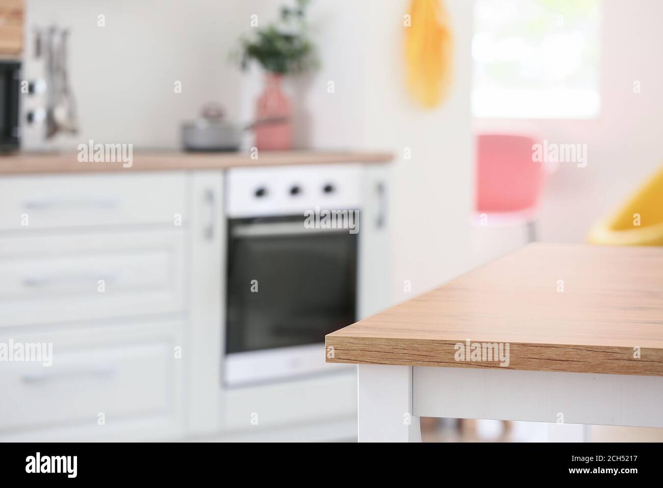 Clean table in interior of modern kitchen Stock Photo - Alamy