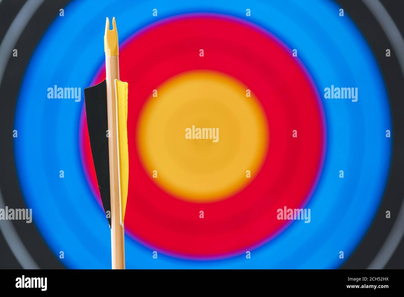 Arrow for archery against target on wall, closeup Stock Photo - Alamy