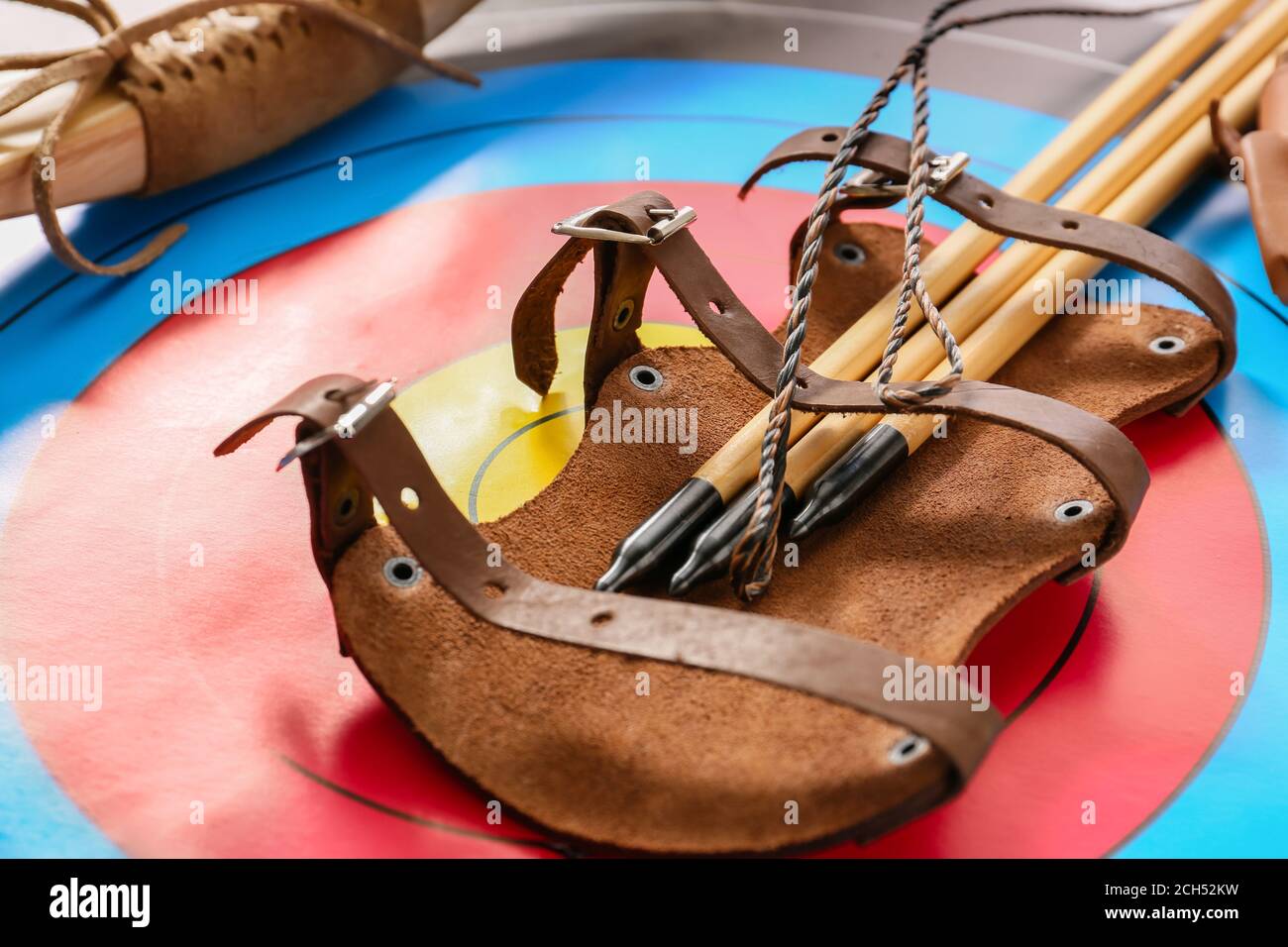 Arrows and protective equipment for archery on target Stock Photo - Alamy