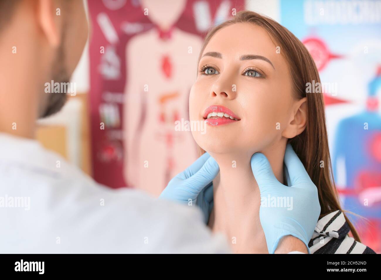 Doctor checking thyroid gland hi-res stock photography and images - Alamy