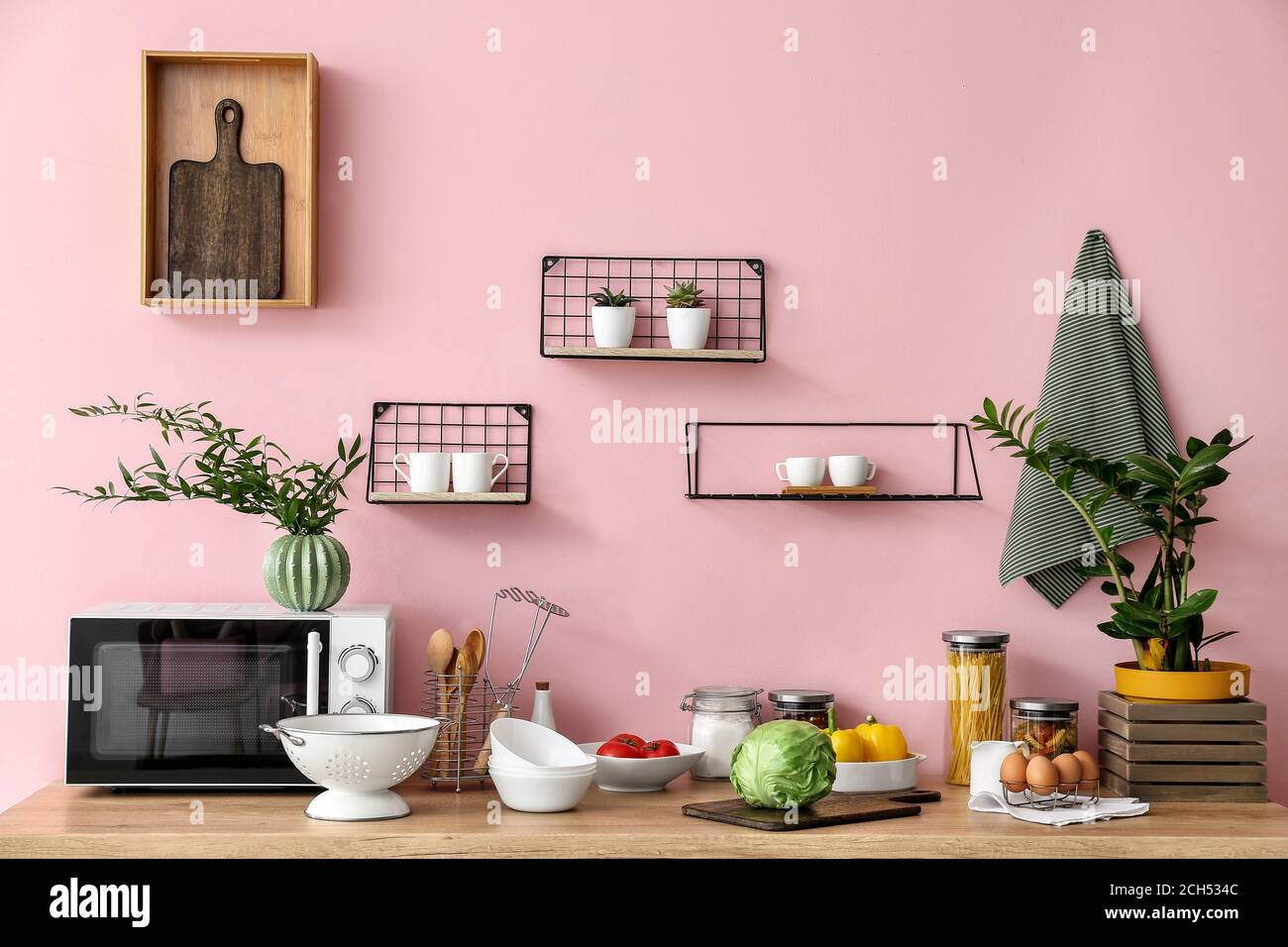 Set of utensils and products on kitchen counter Stock Photo - Alamy