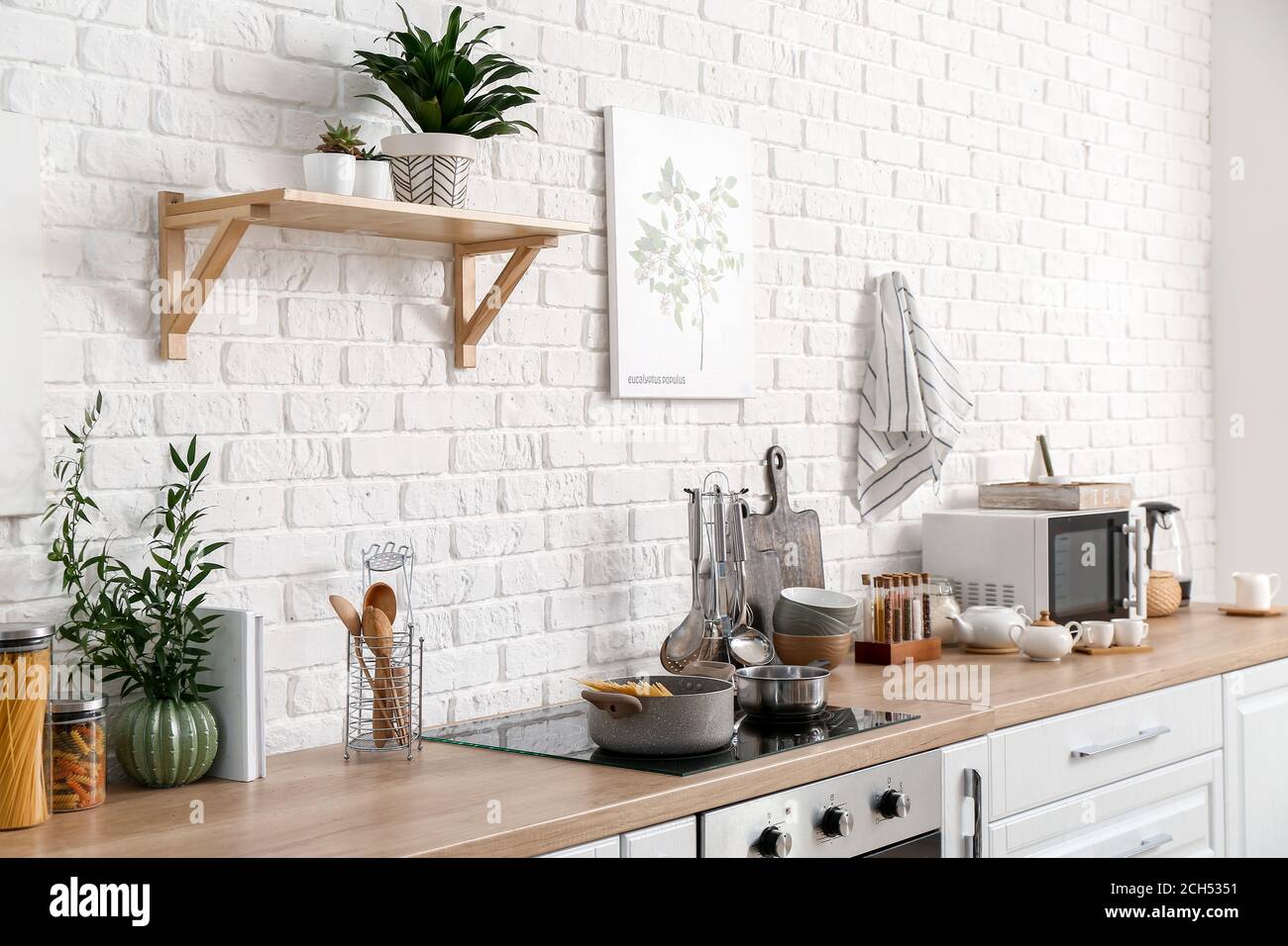 Set of utensils and products on kitchen counter Stock Photo - Alamy