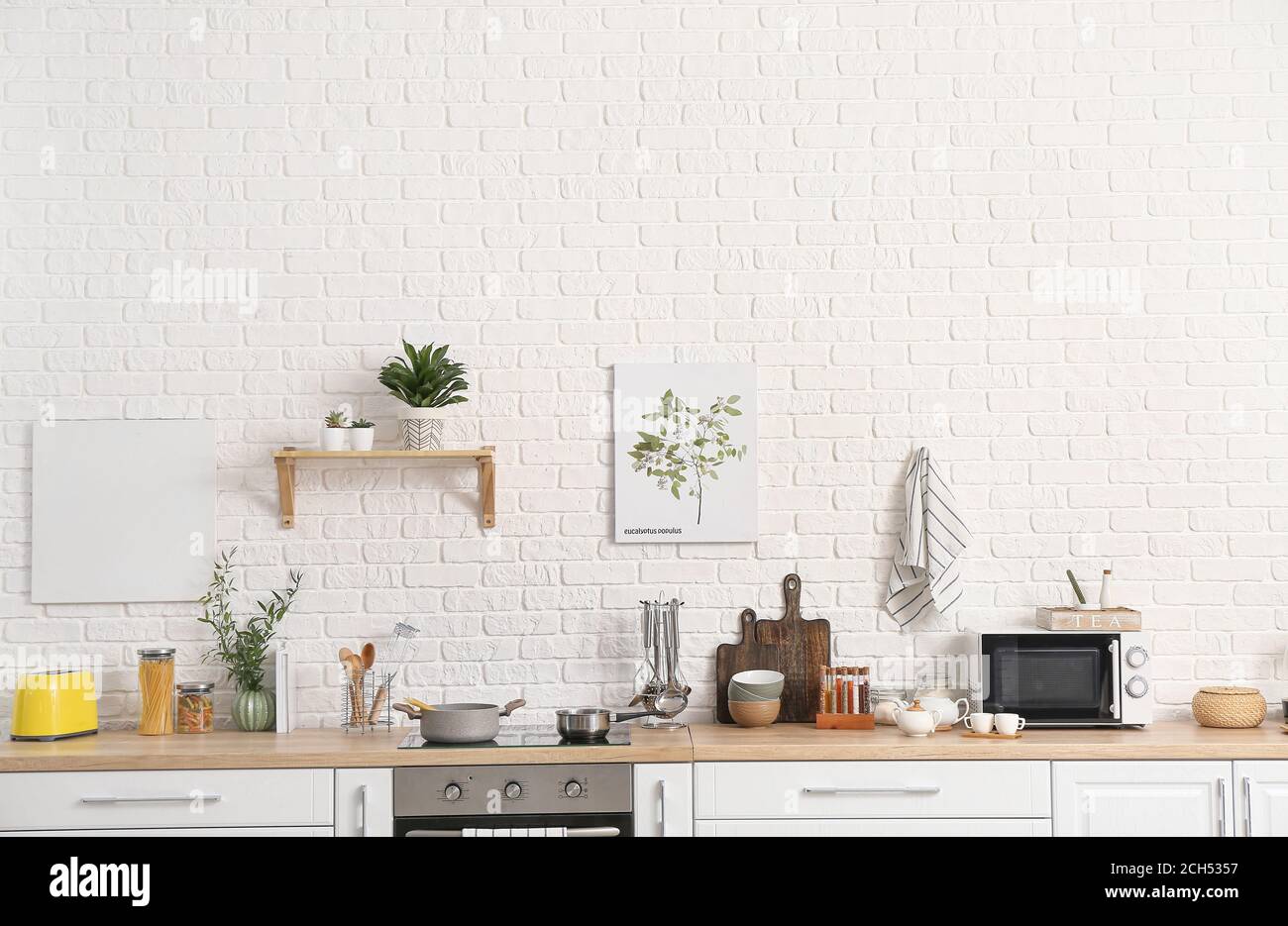 Set of utensils and products on kitchen counter Stock Photo - Alamy