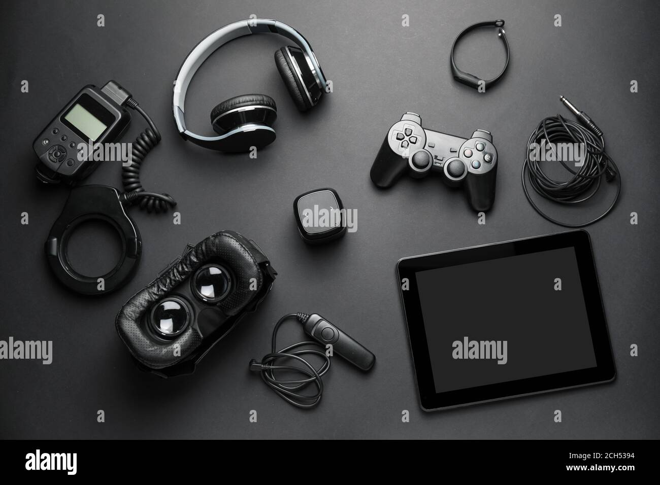 Different modern devices on dark background Stock Photo - Alamy