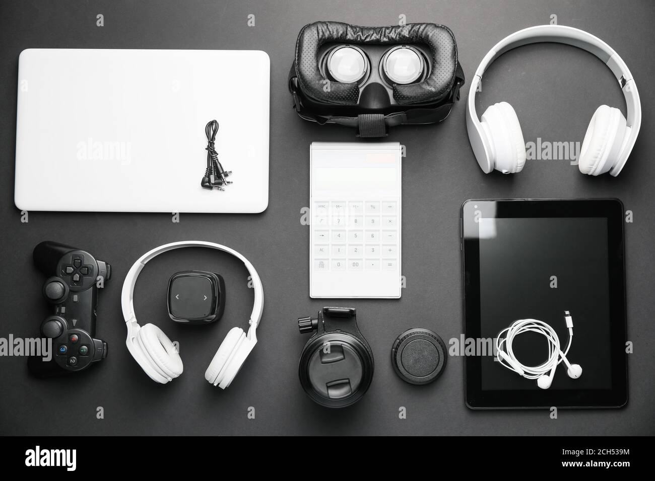 Different modern devices on dark background Stock Photo - Alamy