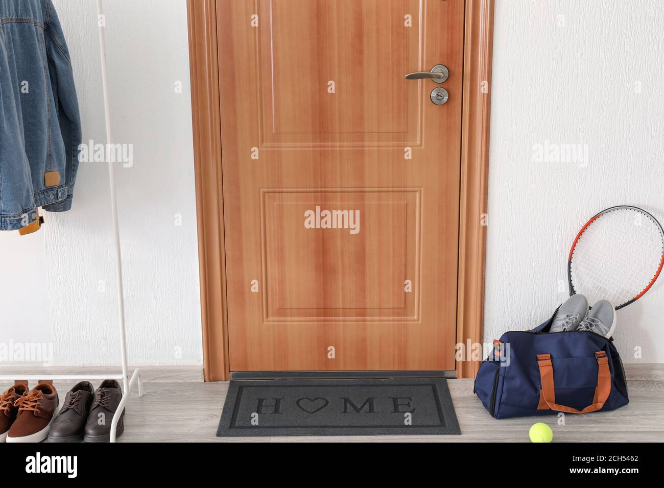 Interior of modern stylish hallway with door mat Stock Photo - Alamy