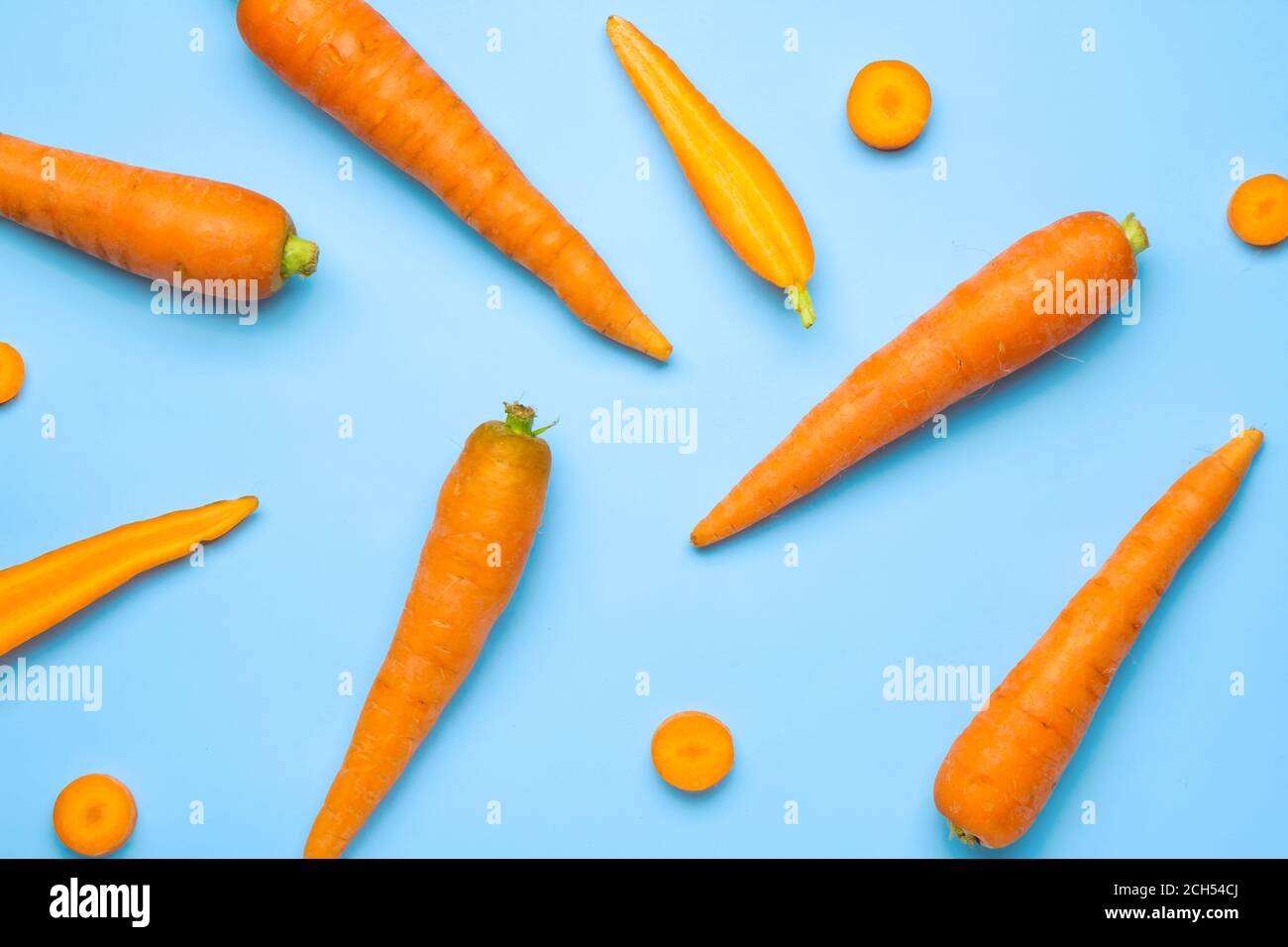 Fresh carrots on color background Stock Photo - Alamy