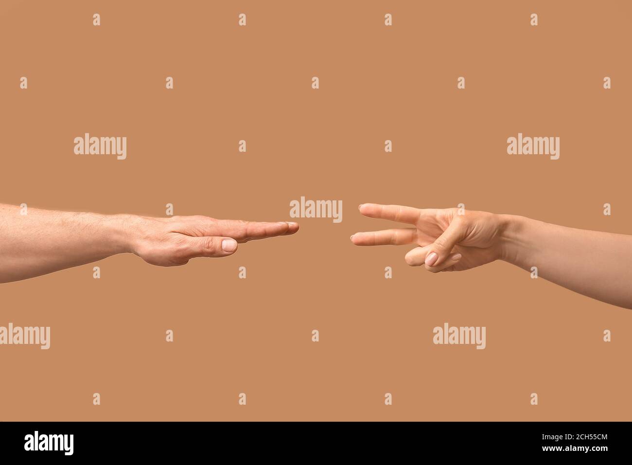 People playing roshambo game on color background Stock Photo - Alamy