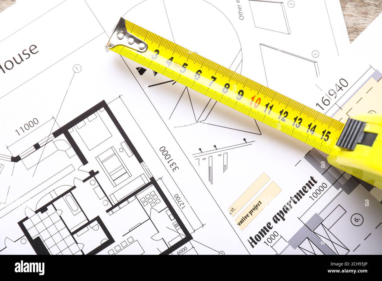 Builder measuring blueprints tape hi-res stock photography and images ...
