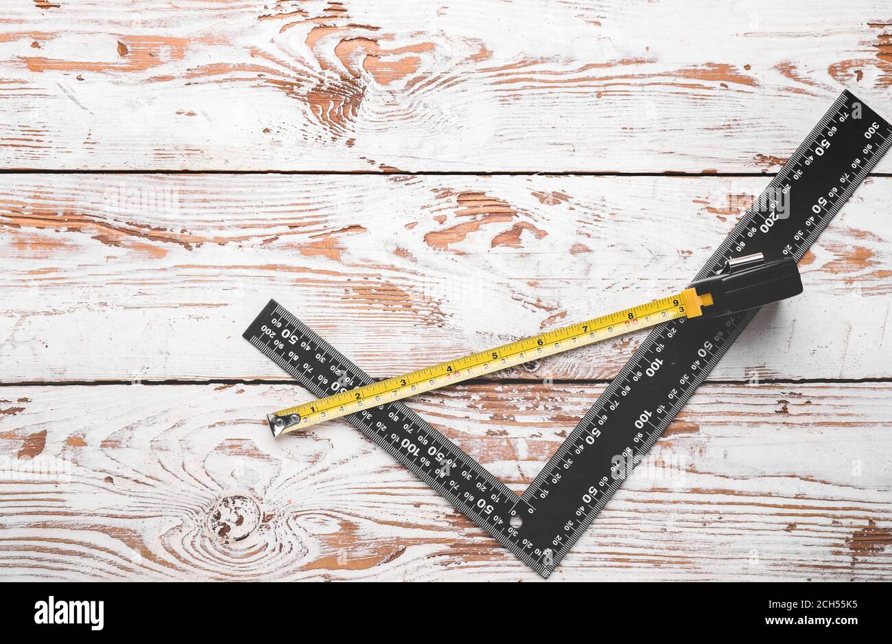 Measuring tape with ruler on table Stock Photo - Alamy