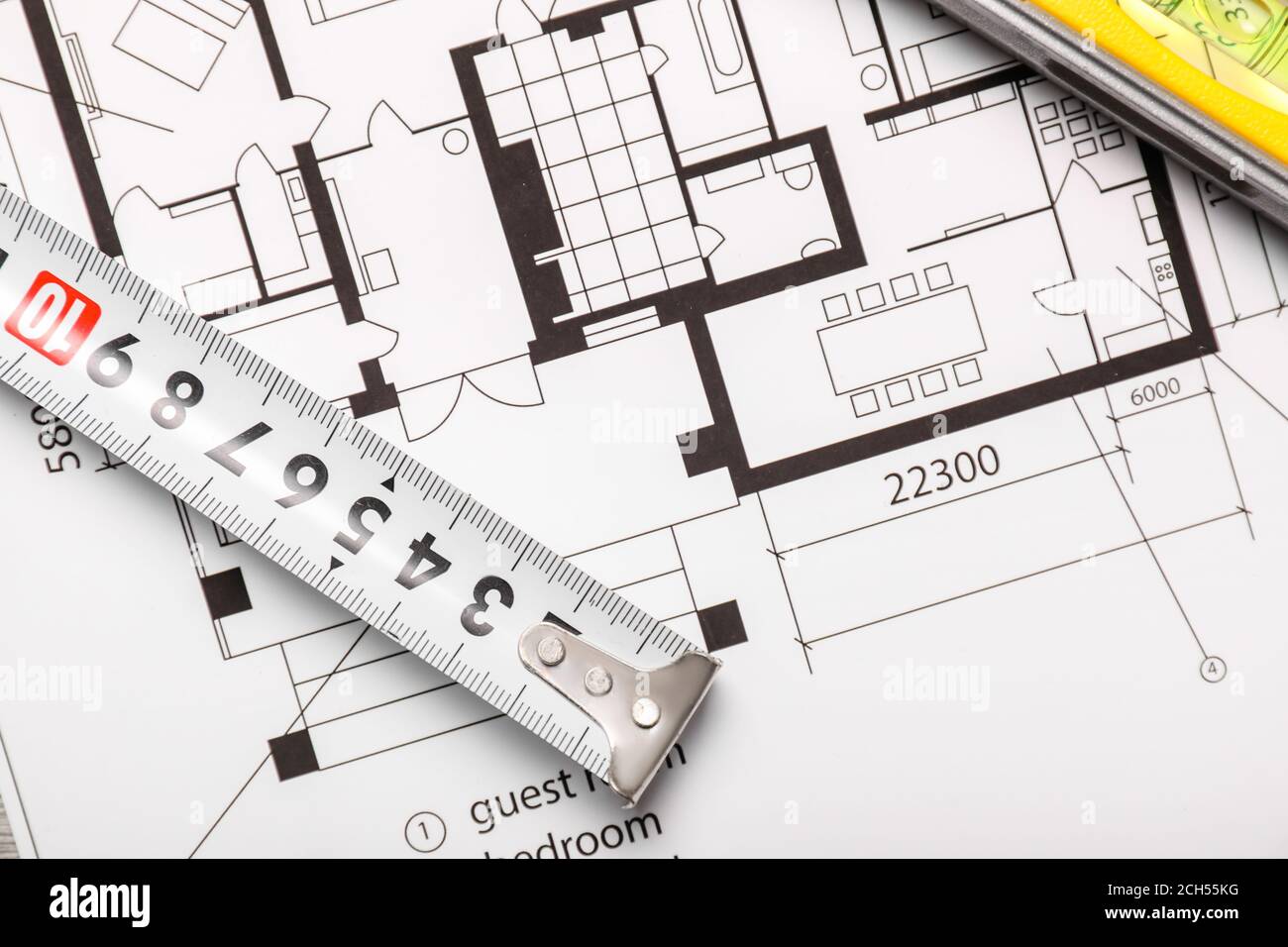 Measuring tape with blueprint, closeup Stock Photo - Alamy