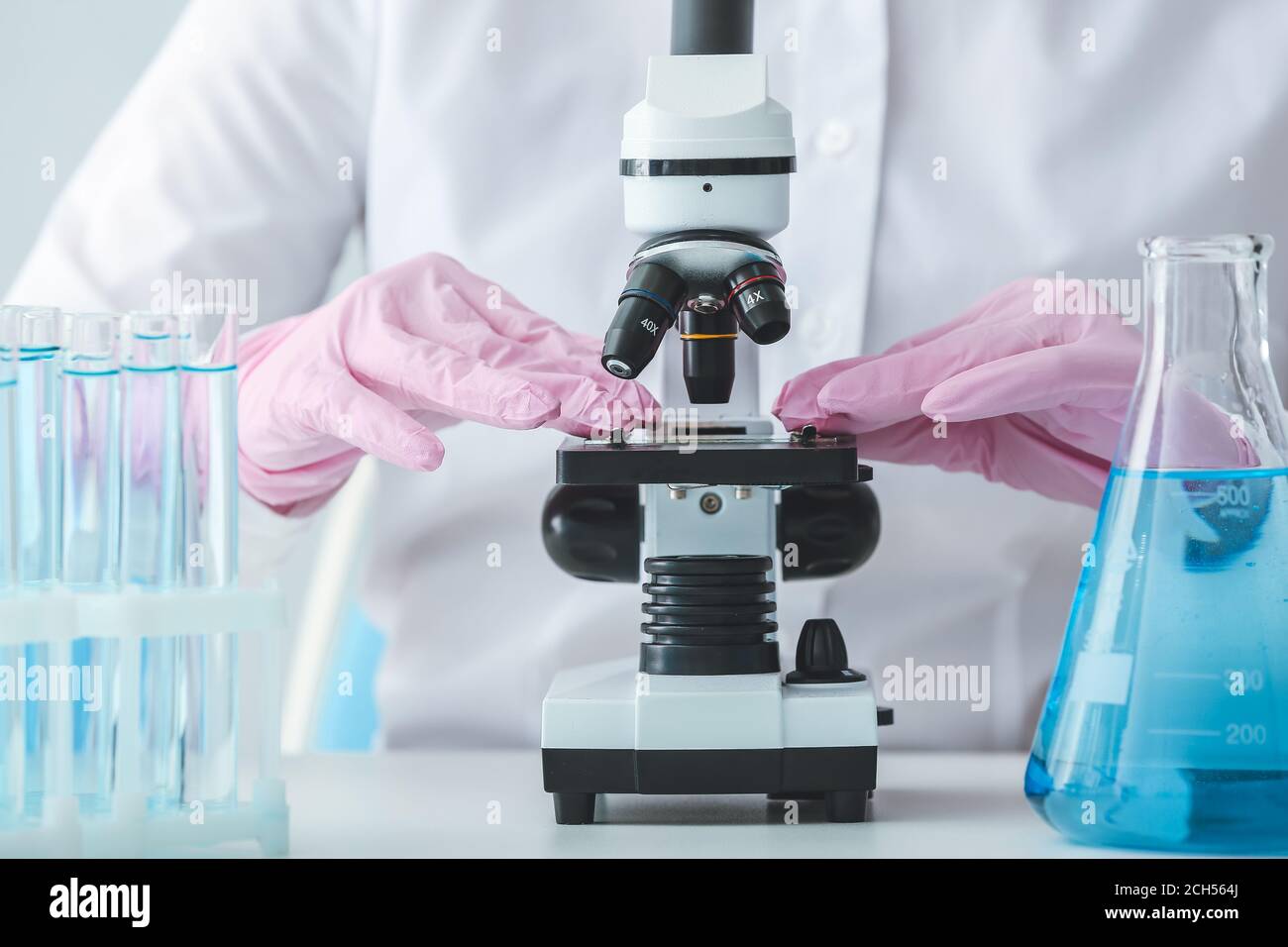 Scientist using microscope in laboratory, closeup Stock Photo - Alamy