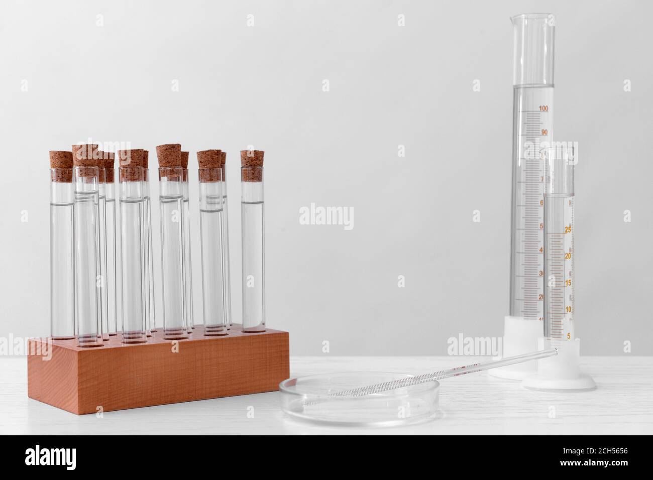 Different glassware on table in laboratory Stock Photo - Alamy