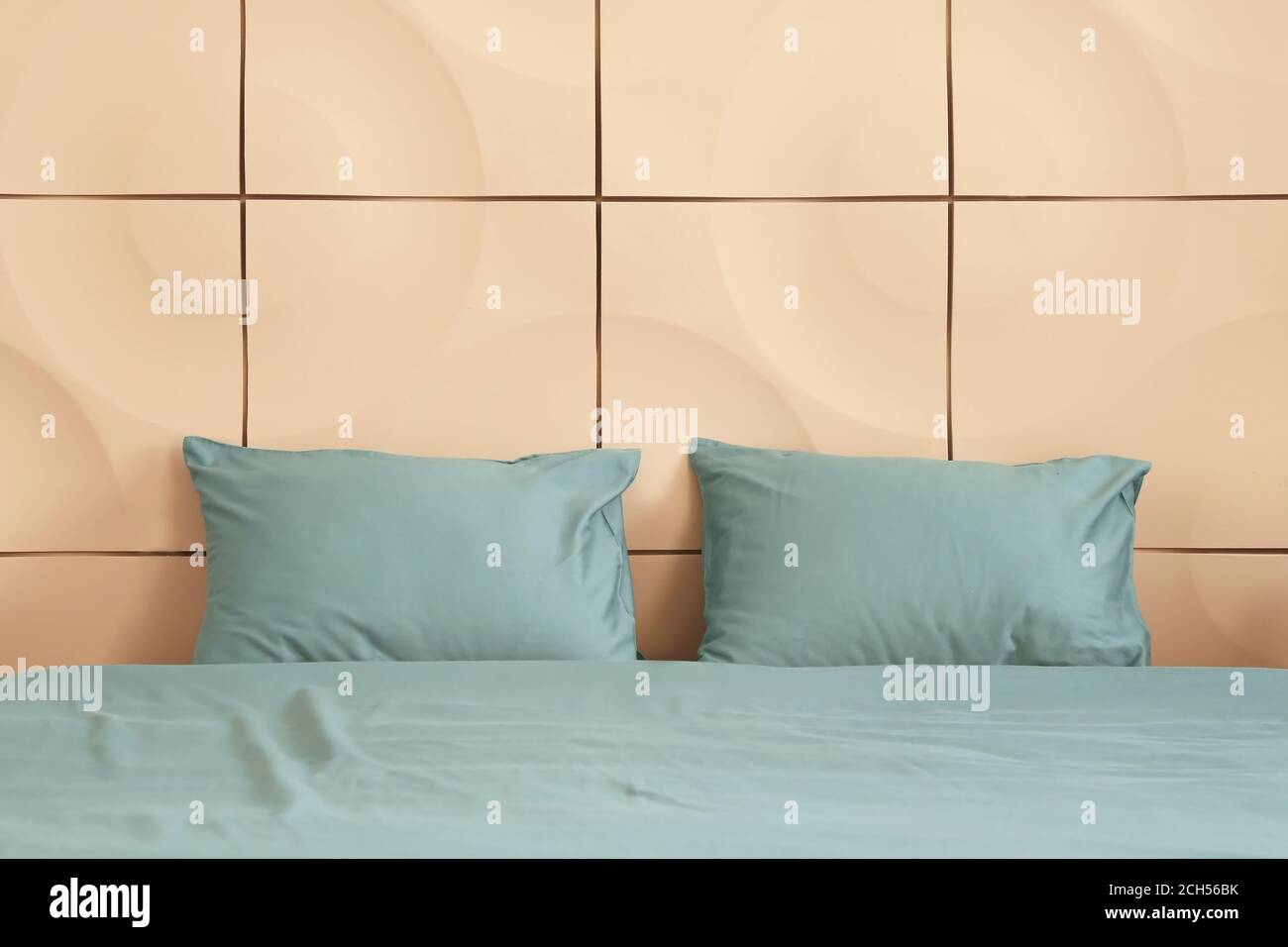 Big comfortable bed in room Stock Photo - Alamy
