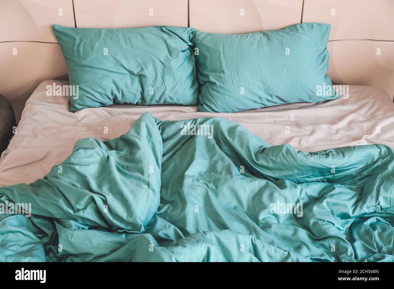 Big comfortable bed in room Stock Photo - Alamy