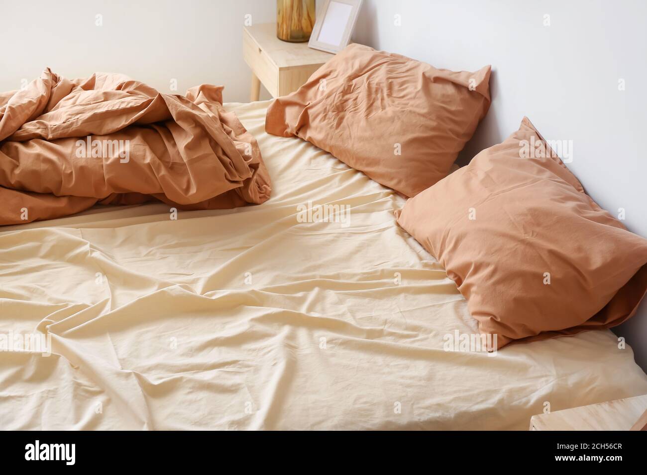 Big comfortable bed in room Stock Photo - Alamy