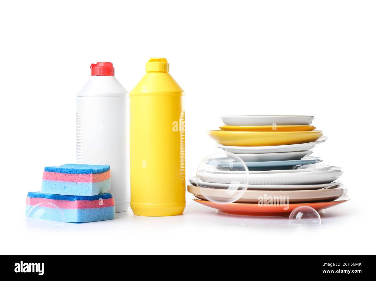 Clean tableware with sponges and detergents on white background Stock ...