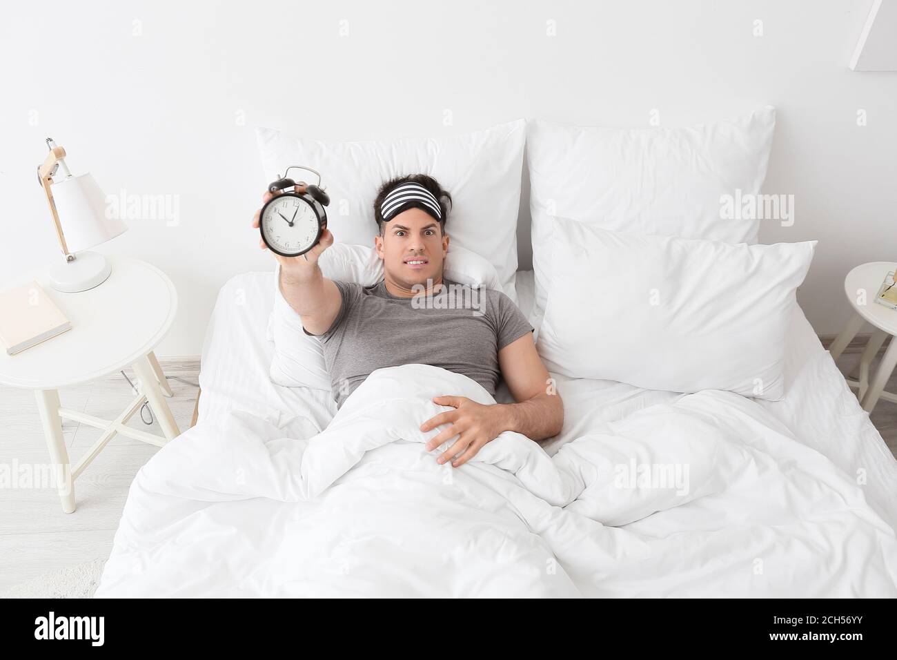 Angry man alarm clock in hi-res stock photography and images - Alamy