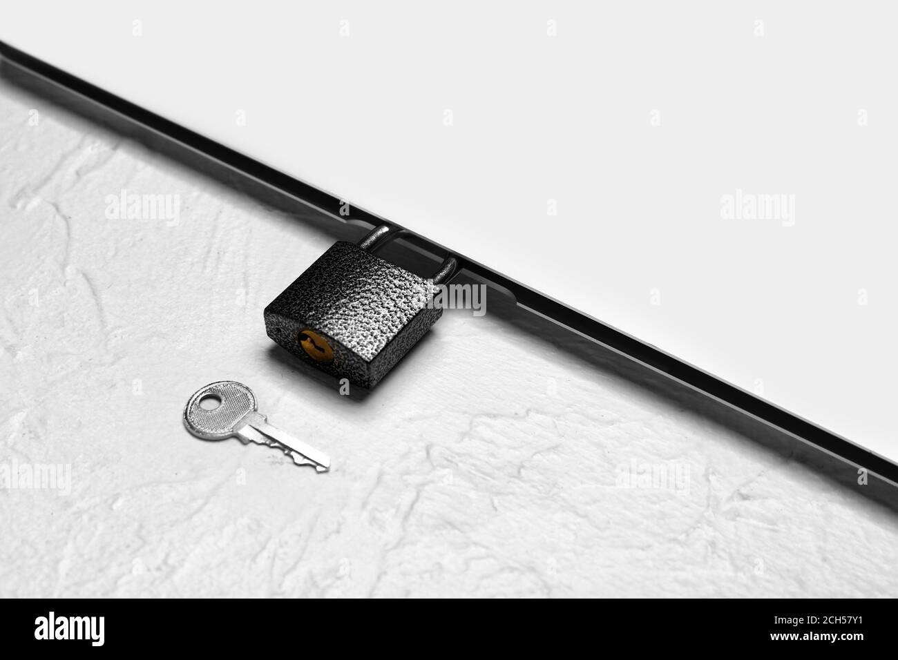 Laptop with padlock and key on white background Stock Photo - Alamy