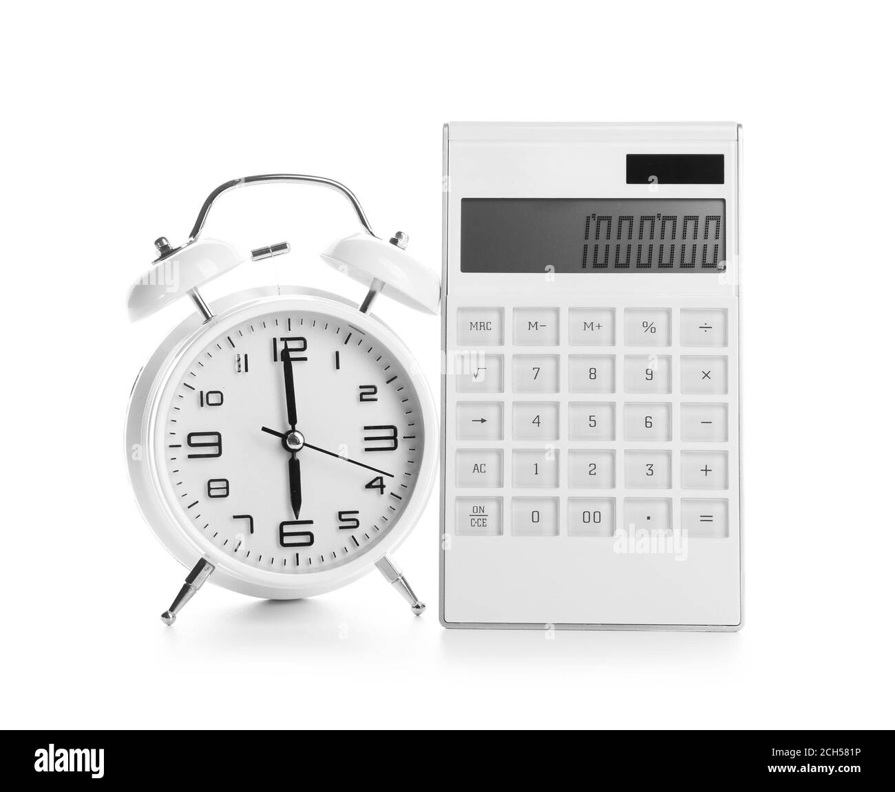 Alarm clock with calculator on white background Stock Photo - Alamy