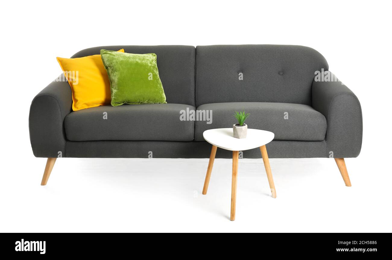 Modern sofa and table on white background Stock Photo - Alamy