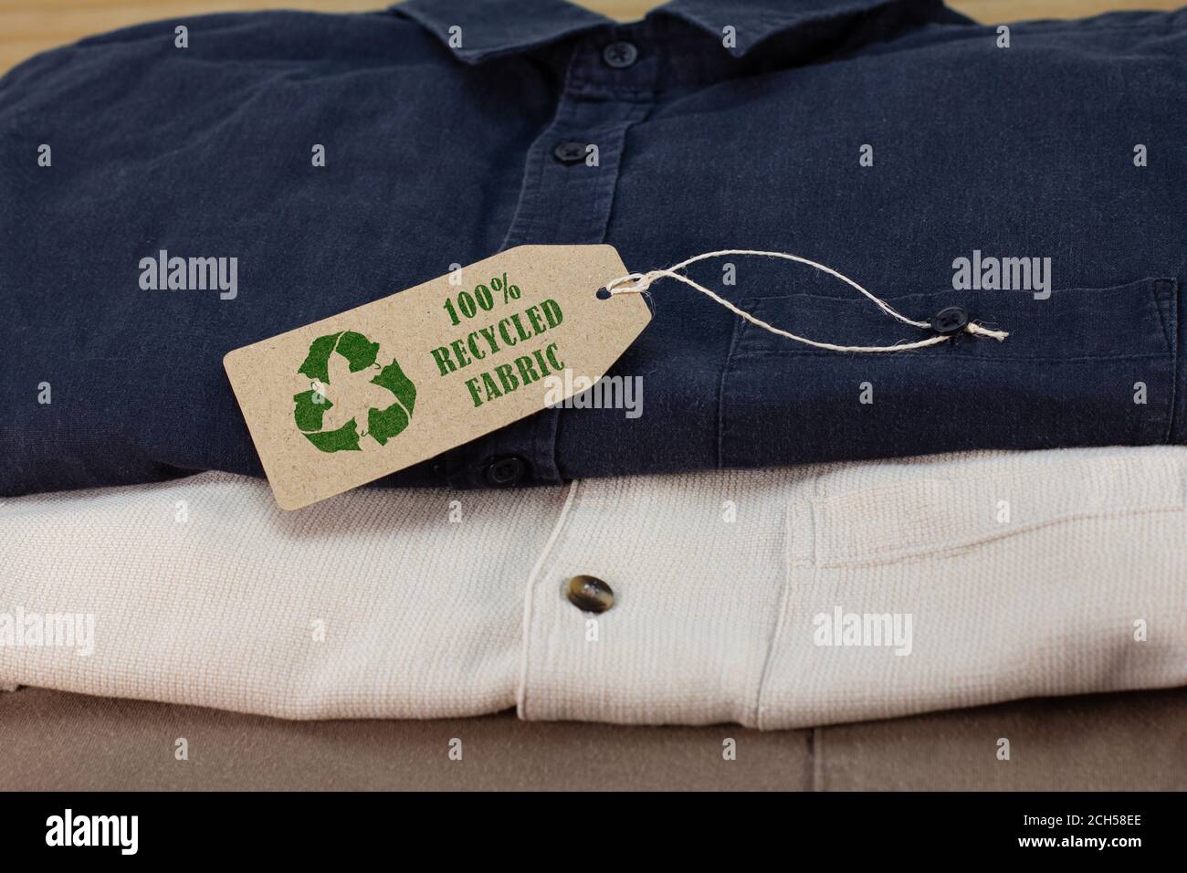shirts with Recycle clothes icon on label with 100% Recycled fabric ...