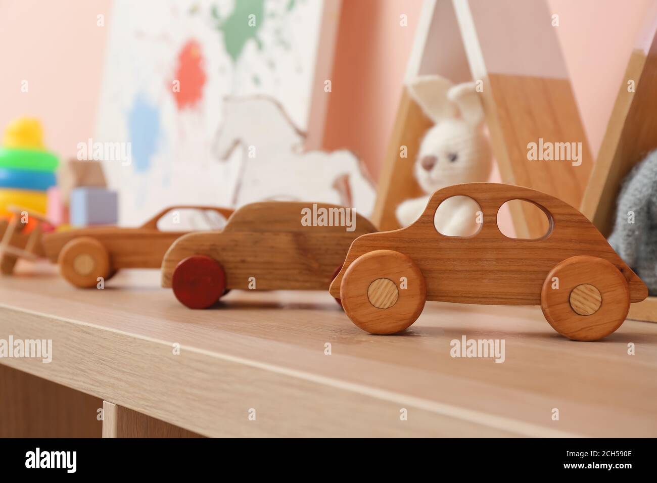 Children's toys on table in room Stock Photo - Alamy