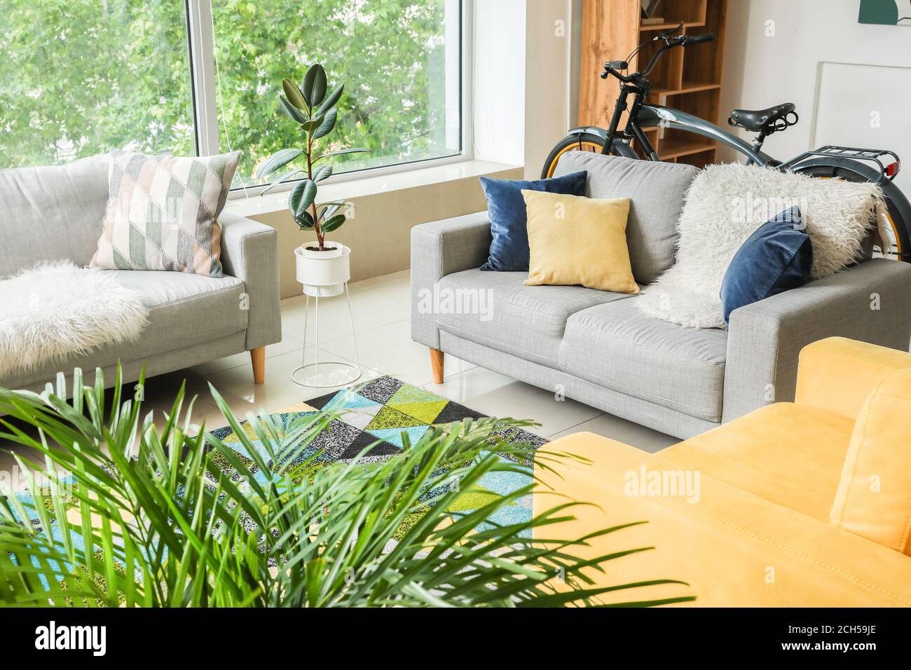 Stylish interior of living room with comfortable furniture Stock Photo ...