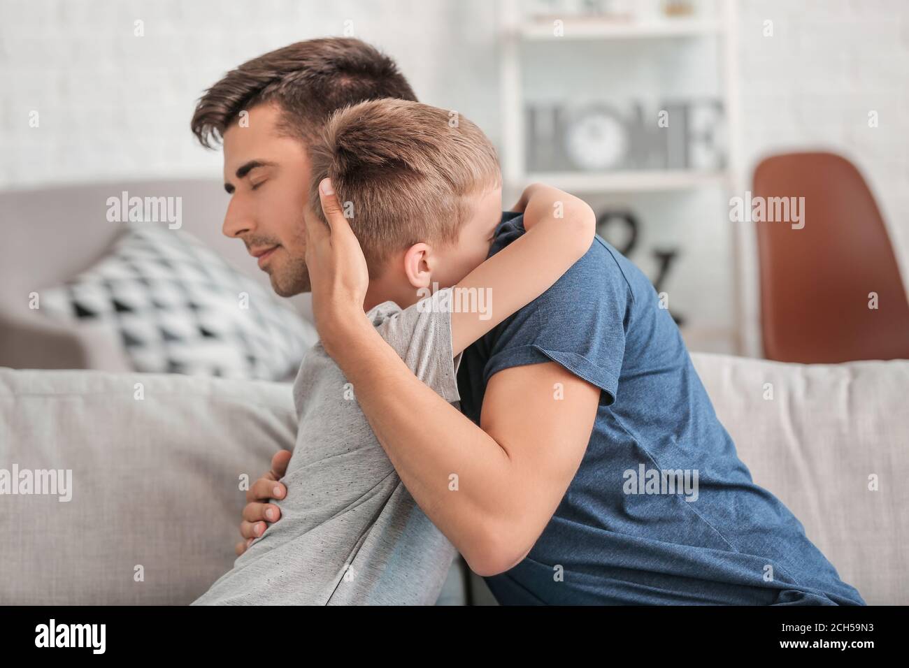 Father trying to make peace with son after quarrel at home Stock Photo ...