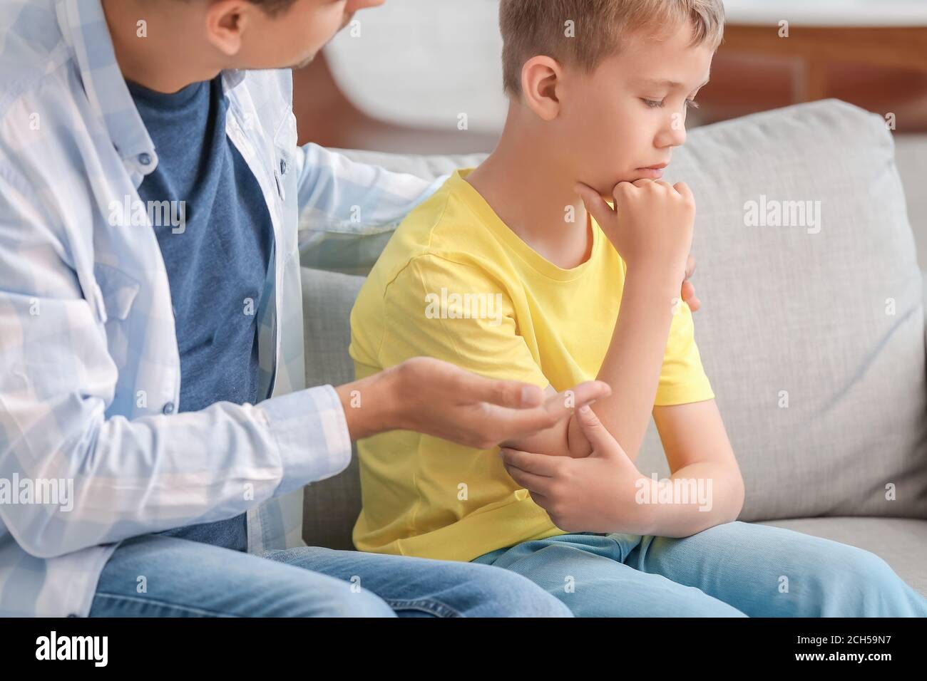 Father trying to make peace with son after quarrel at home Stock Photo ...