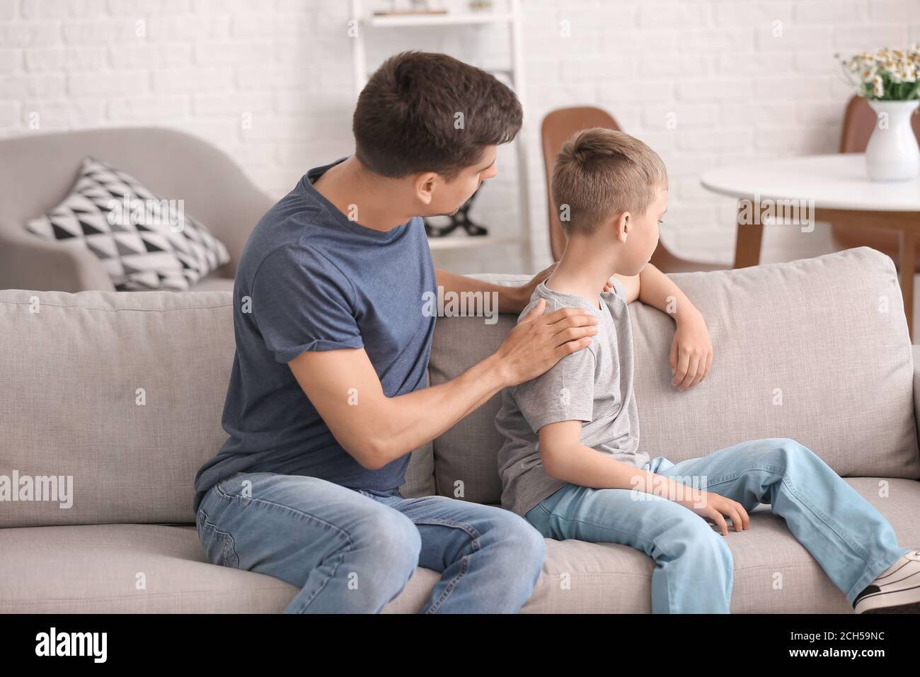 Father trying to make peace with son after quarrel at home Stock Photo ...