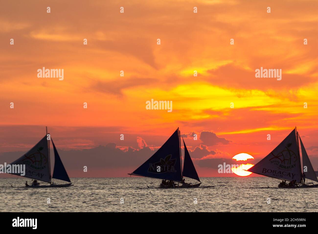 Local sailboats called paraw during sunset in Boracay Stock Photo - Alamy