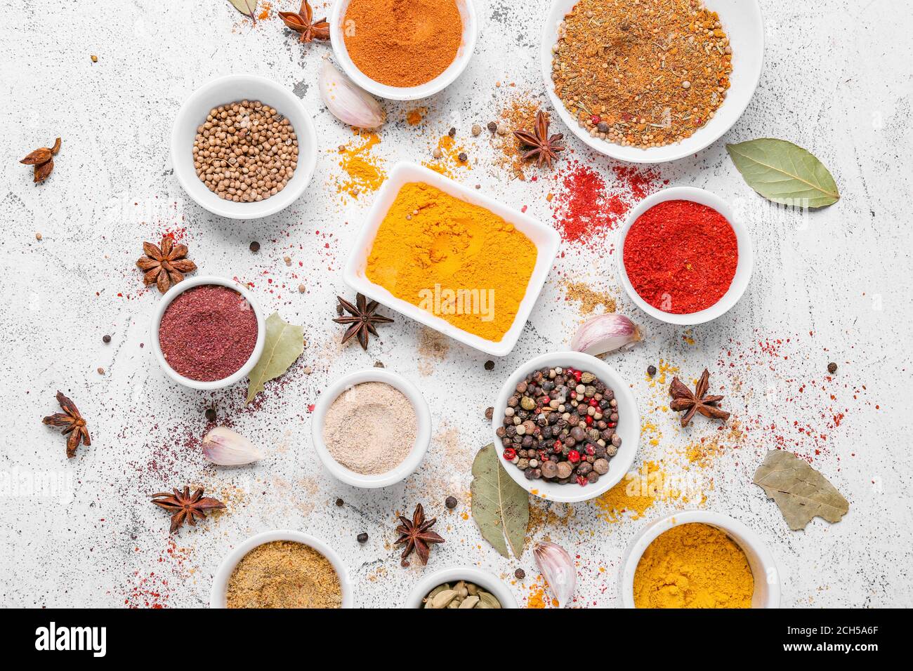 Bowls with different aromatic spices on white background Stock Photo ...