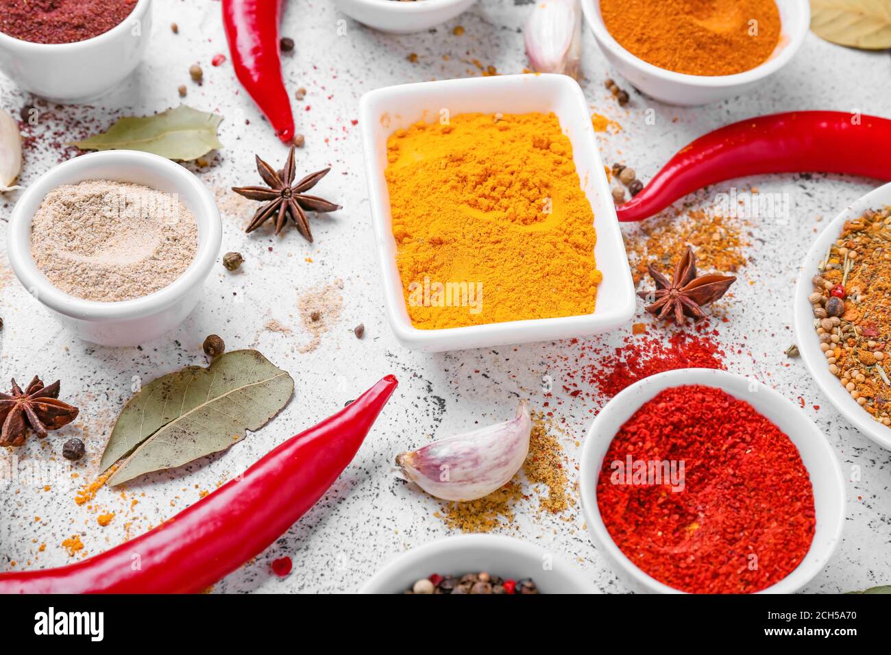 Bowls with different aromatic spices on white background Stock Photo ...