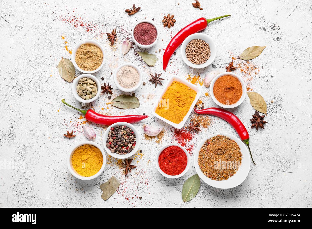 Bowls with different aromatic spices on white background Stock Photo ...