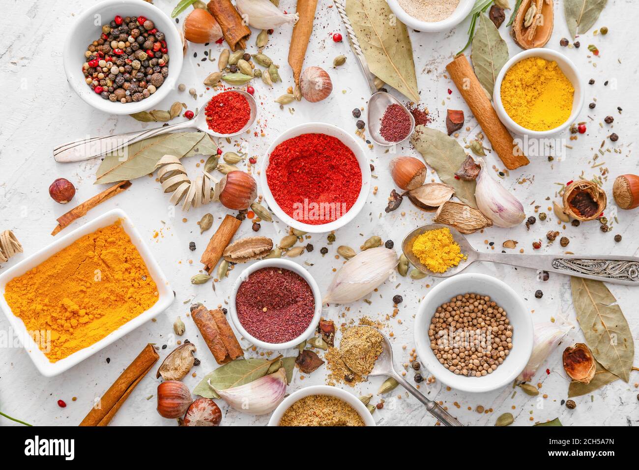 Bowls with different aromatic spices on white background Stock Photo ...
