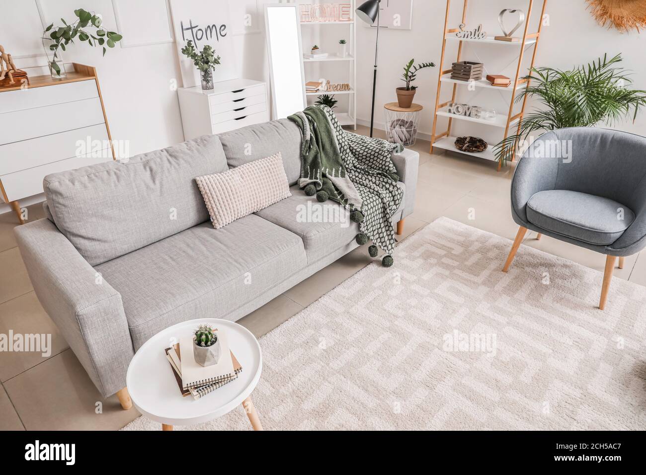Stylish interior of living room with comfortable furniture Stock Photo ...