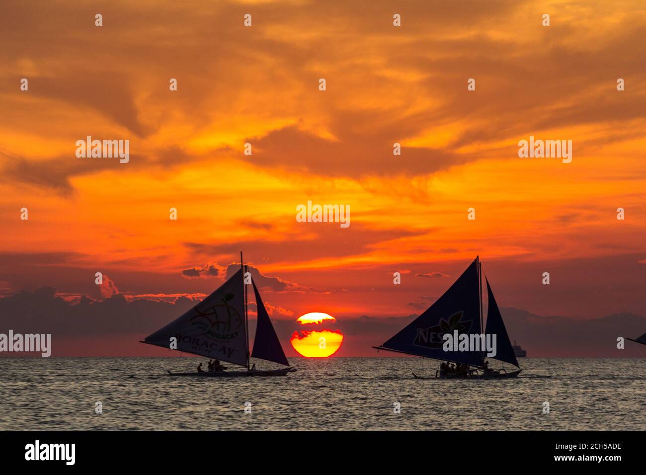 Local sailboats called paraw during sunset in Boracay Stock Photo - Alamy