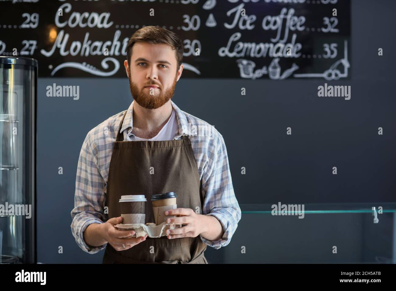 Male barista in modern cafe Stock Photo - Alamy