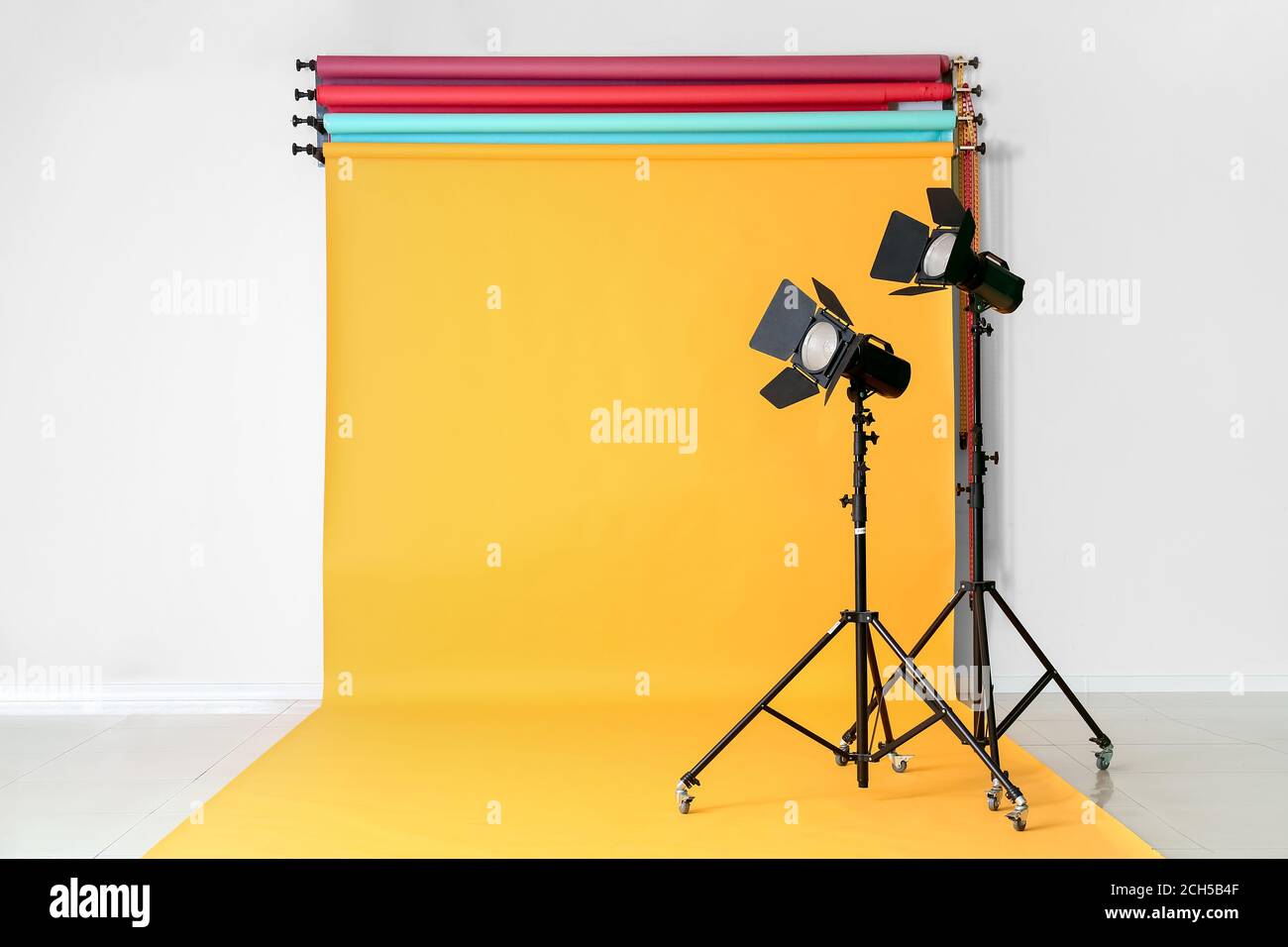 Color backdrops and modern equipment in photo studio Stock Photo - Alamy
