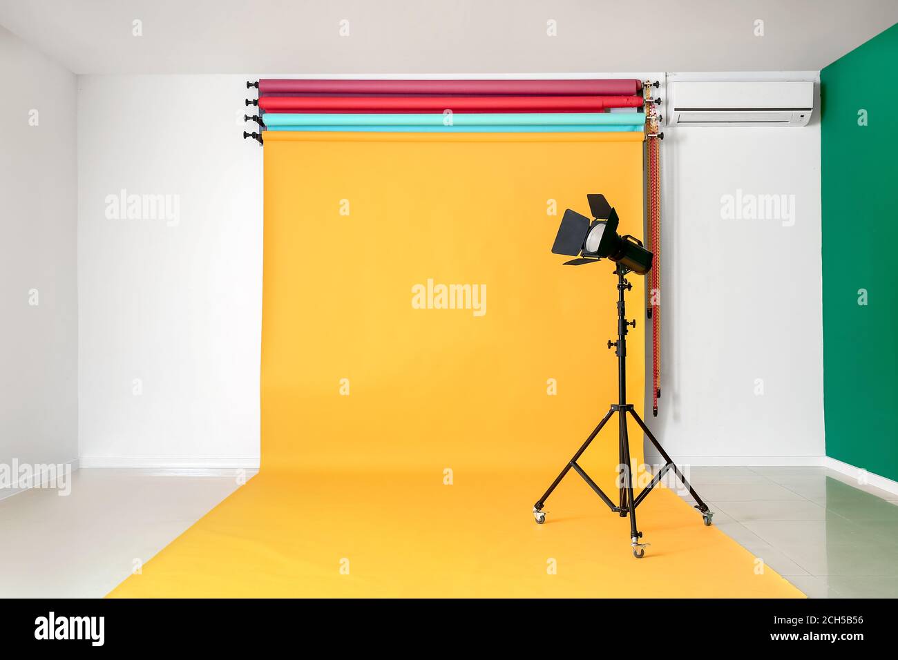 Color backdrops and modern equipment in photo studio Stock Photo - Alamy