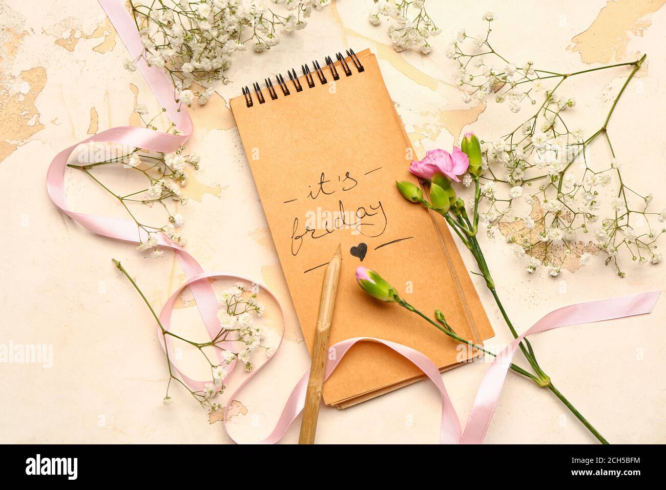 Notebook with text IT'S FRIDAY on white background Stock Photo - Alamy