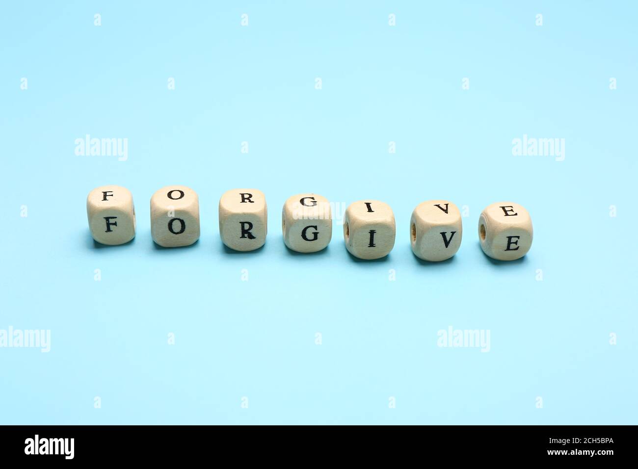 Cubes with word FORGIVE on color background Stock Photo - Alamy