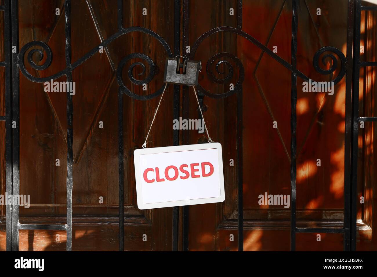 Board with word CLOSED hanging on door outdoors Stock Photo - Alamy