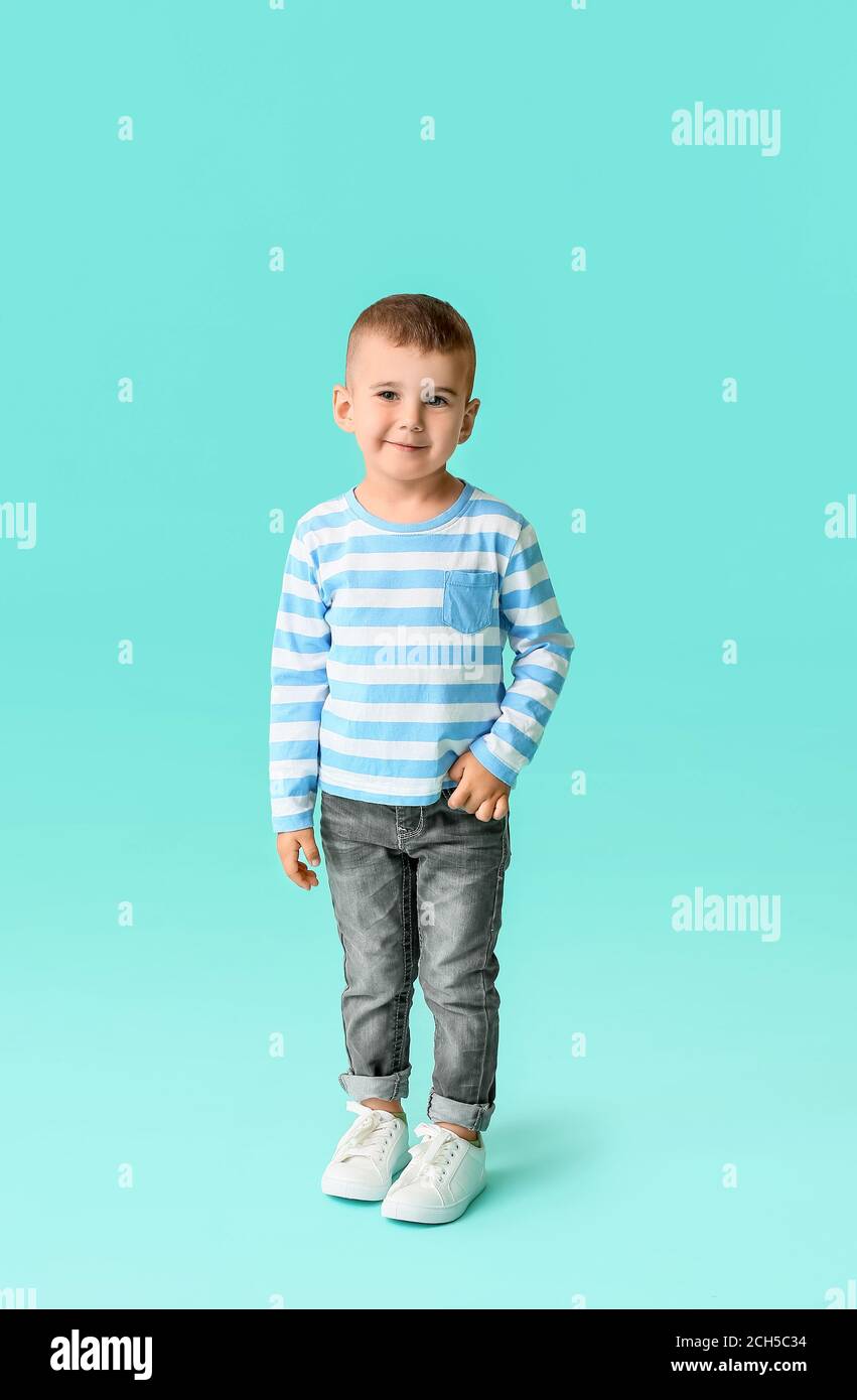 Cute little boy on color background Stock Photo - Alamy