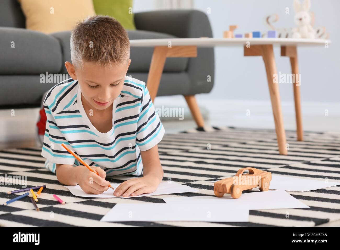 Cute little boy drawing at home Stock Photo - Alamy